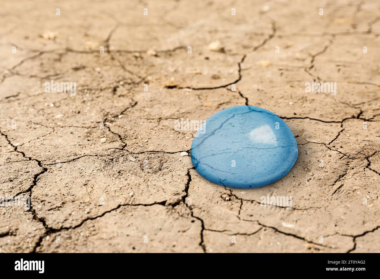 Save environment. Water drop on dry cracked land, closeup Stock Photo ...