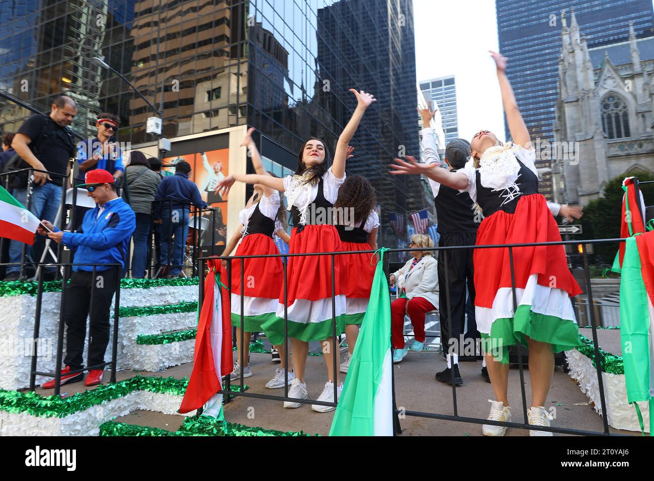 Members of “The Italian Fairy” dance on a float heading up 5th Avenue ...