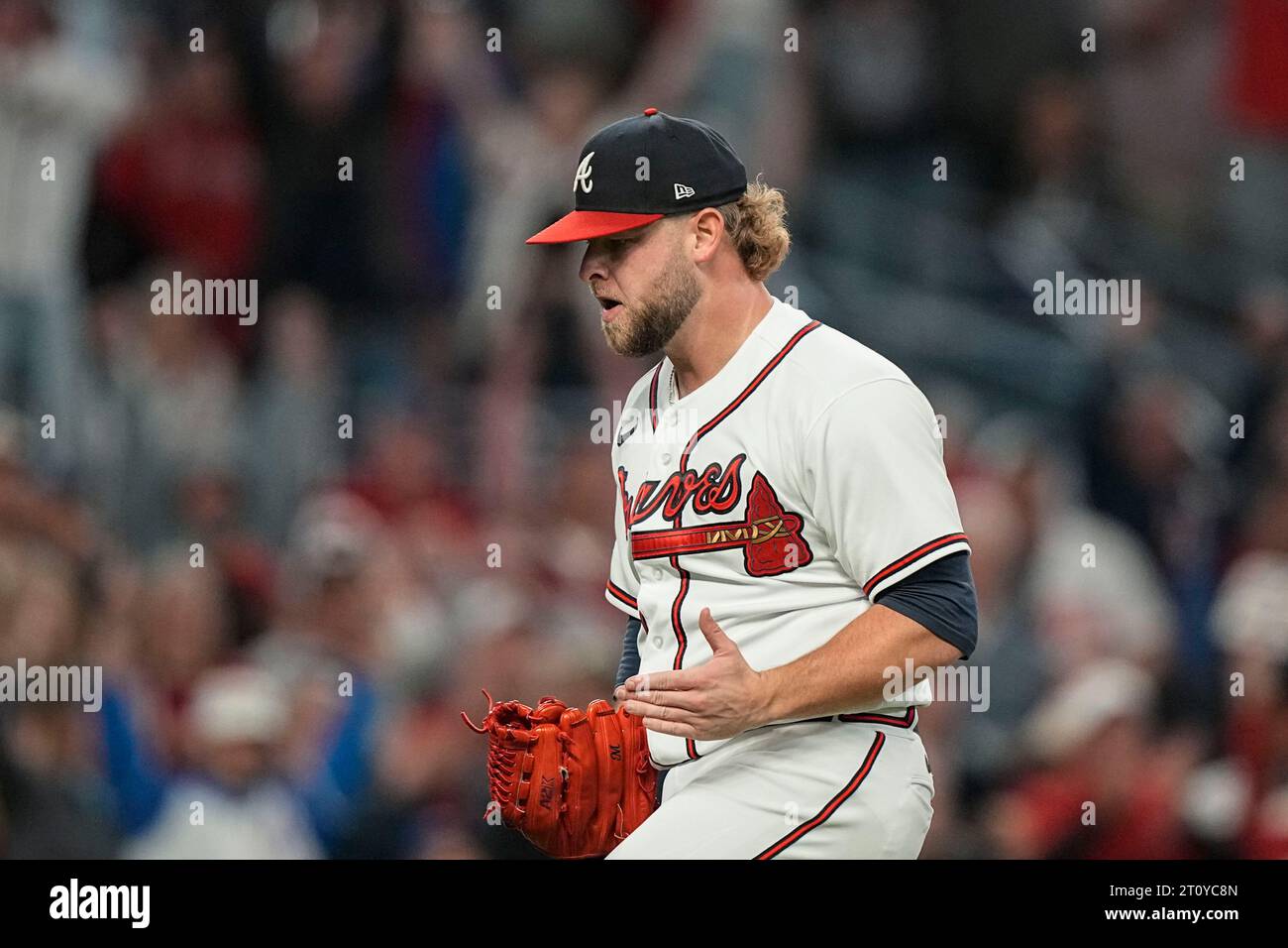 Atlanta Braves relief pitcher A.J. Minter (33) reacts after ...