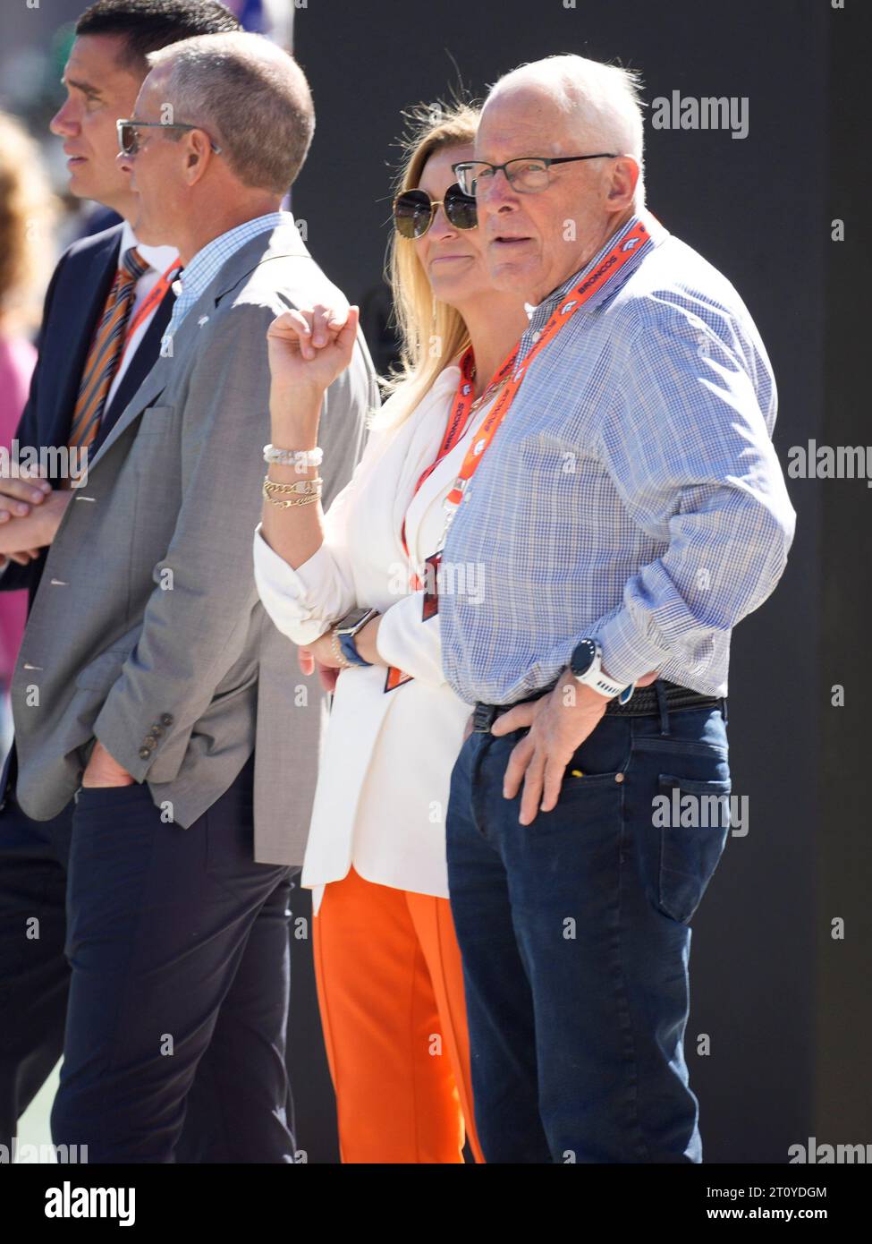 Rob Walton, front, joins his daughter, Carrie Walton Penner, center ...