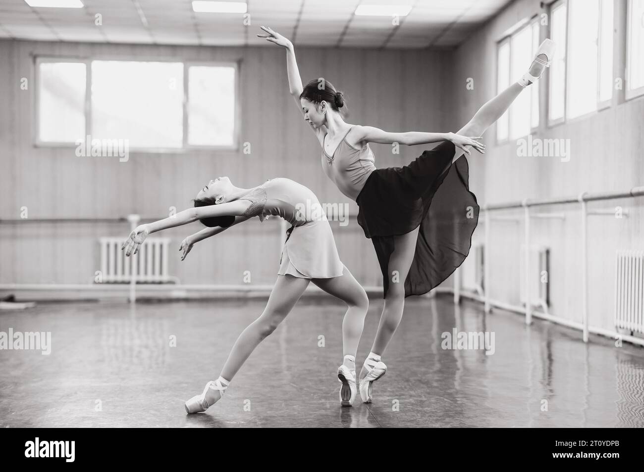 Two Asian ballerinas are dancing in the class. Monochrome Stock Photo ...
