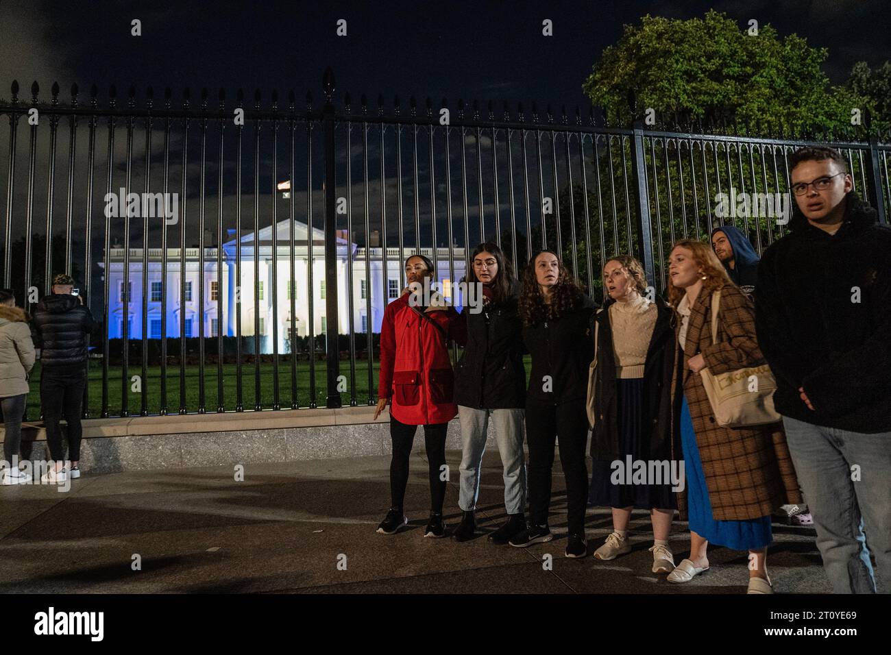 Washington, United States. 09th Oct, 2023. People gather and sing ...