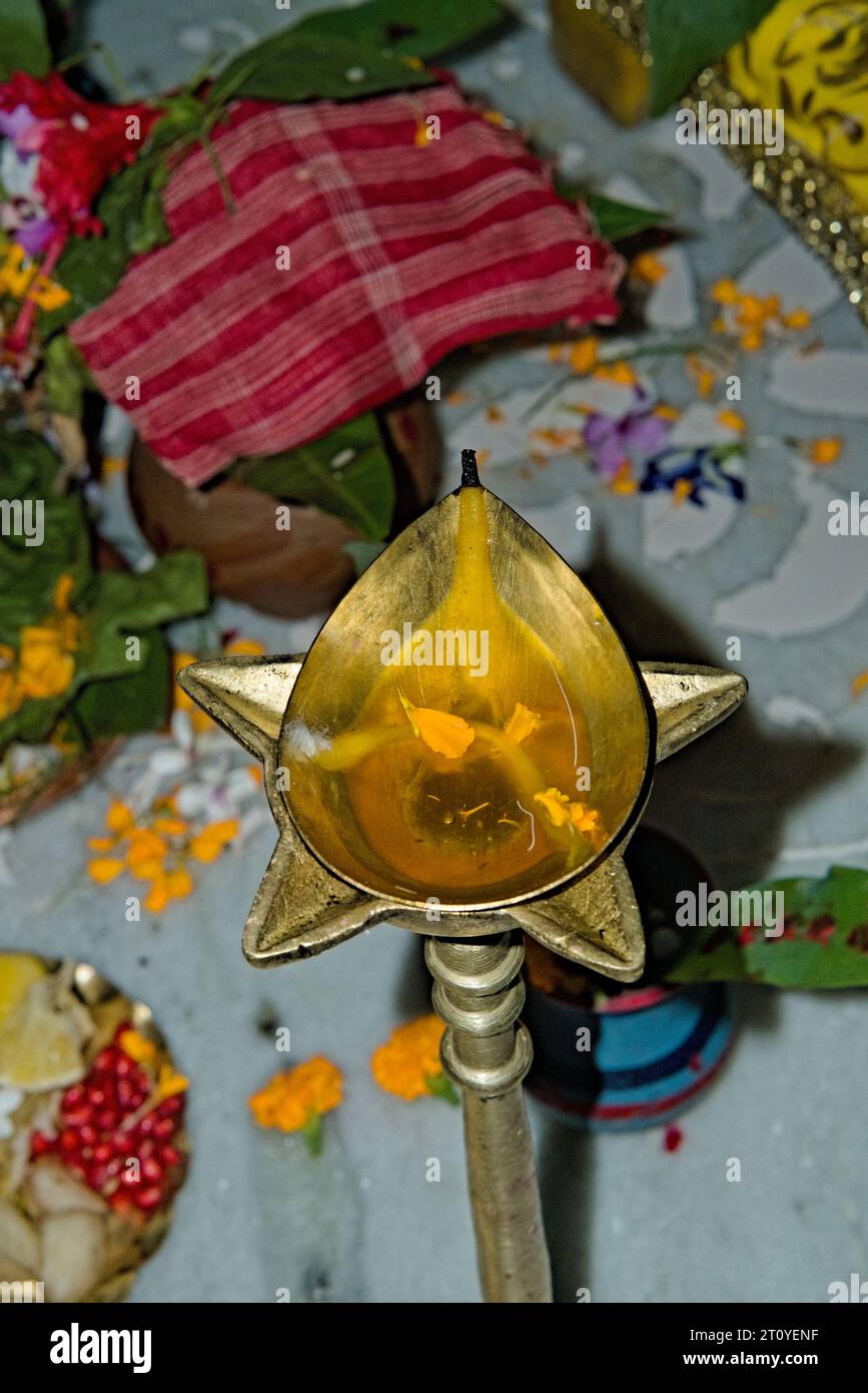 metal oil filled lamp used in puja for lighting flames Stock Photo - Alamy