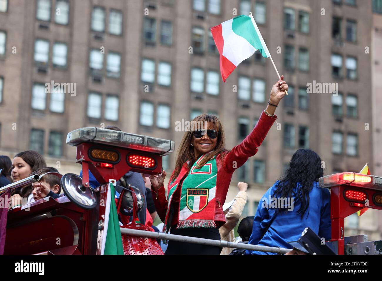 Italian-Americans wave flags of Italy while riding floats up 5th Avenue ...