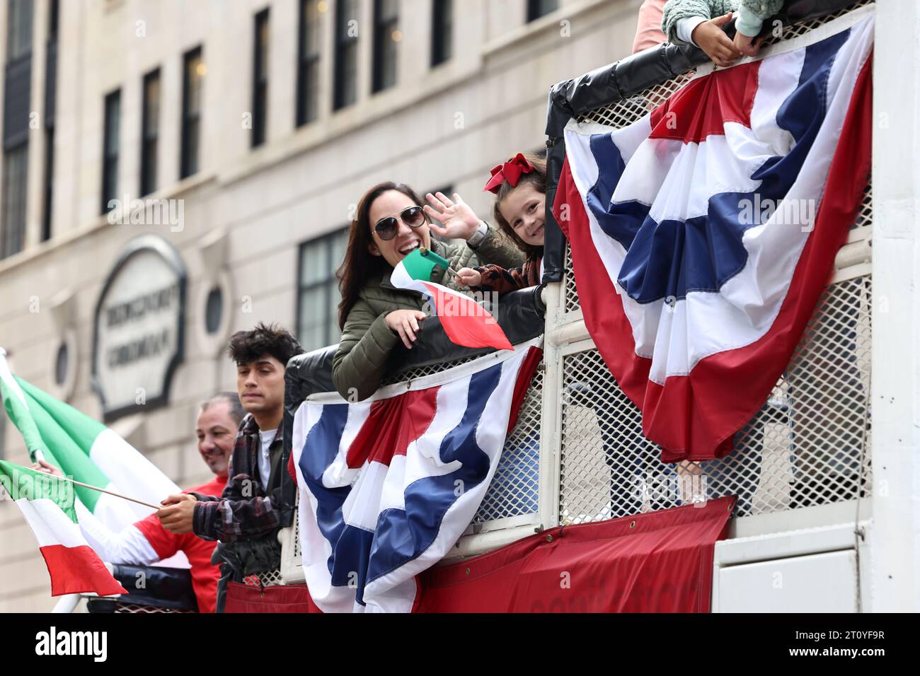 Italian-Americans wave flags of Italy while riding floats up 5th Avenue ...