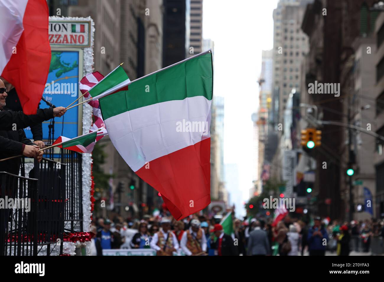 Italian-Americans wave flags of Italy while riding floats up 5th Avenue ...