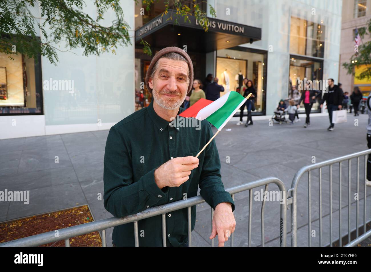 An Italian-American man waves a flag of Italy along 5th Avenue during ...