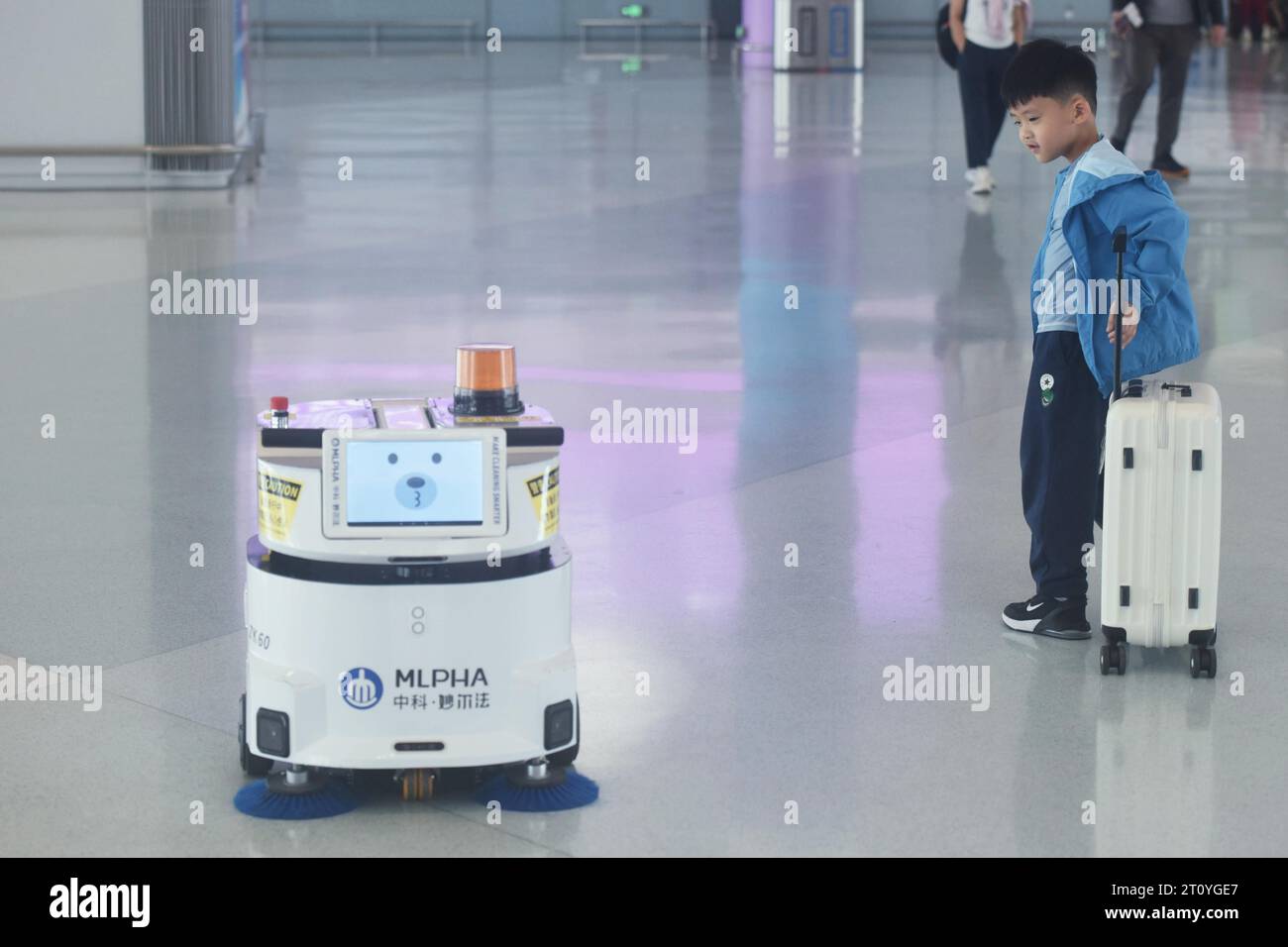 An intelligent sweeping robot works at Hangzhou Xiaoshan International ...