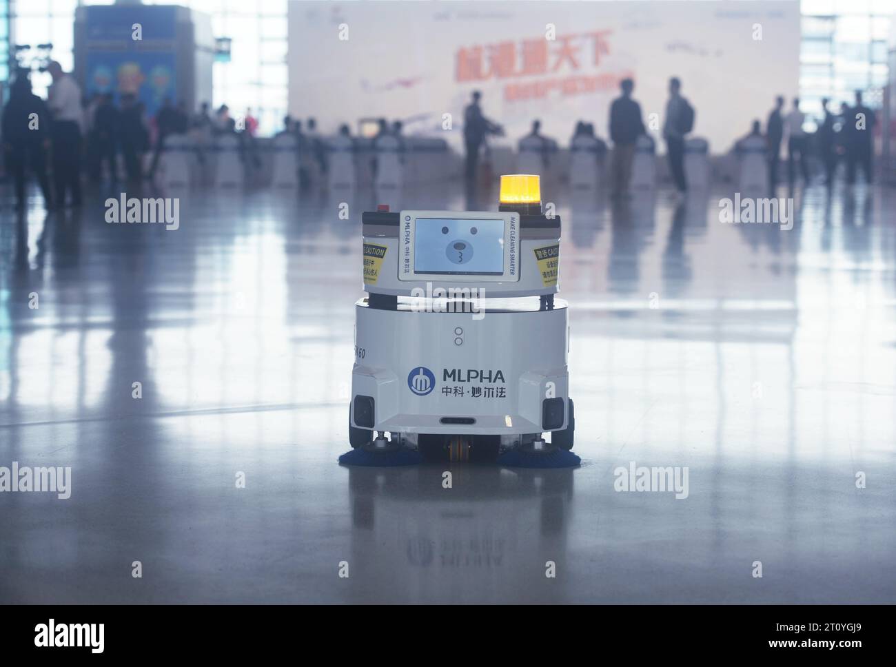 An intelligent sweeping robot works at Hangzhou Xiaoshan International ...
