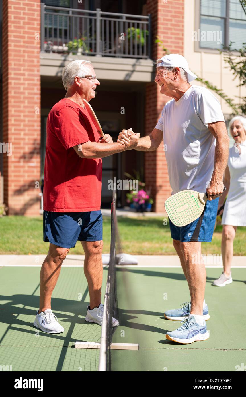 Seniors playing games outdoors Stock Photo - Alamy