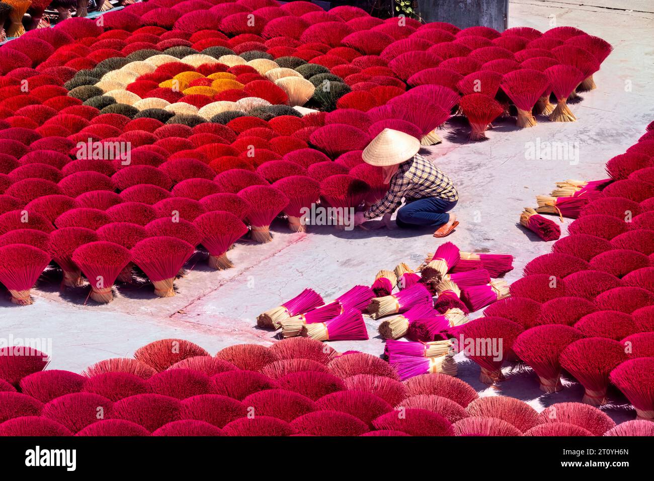 Worker drying incense in the Quang Phu Cau incense village, Hanoi ...