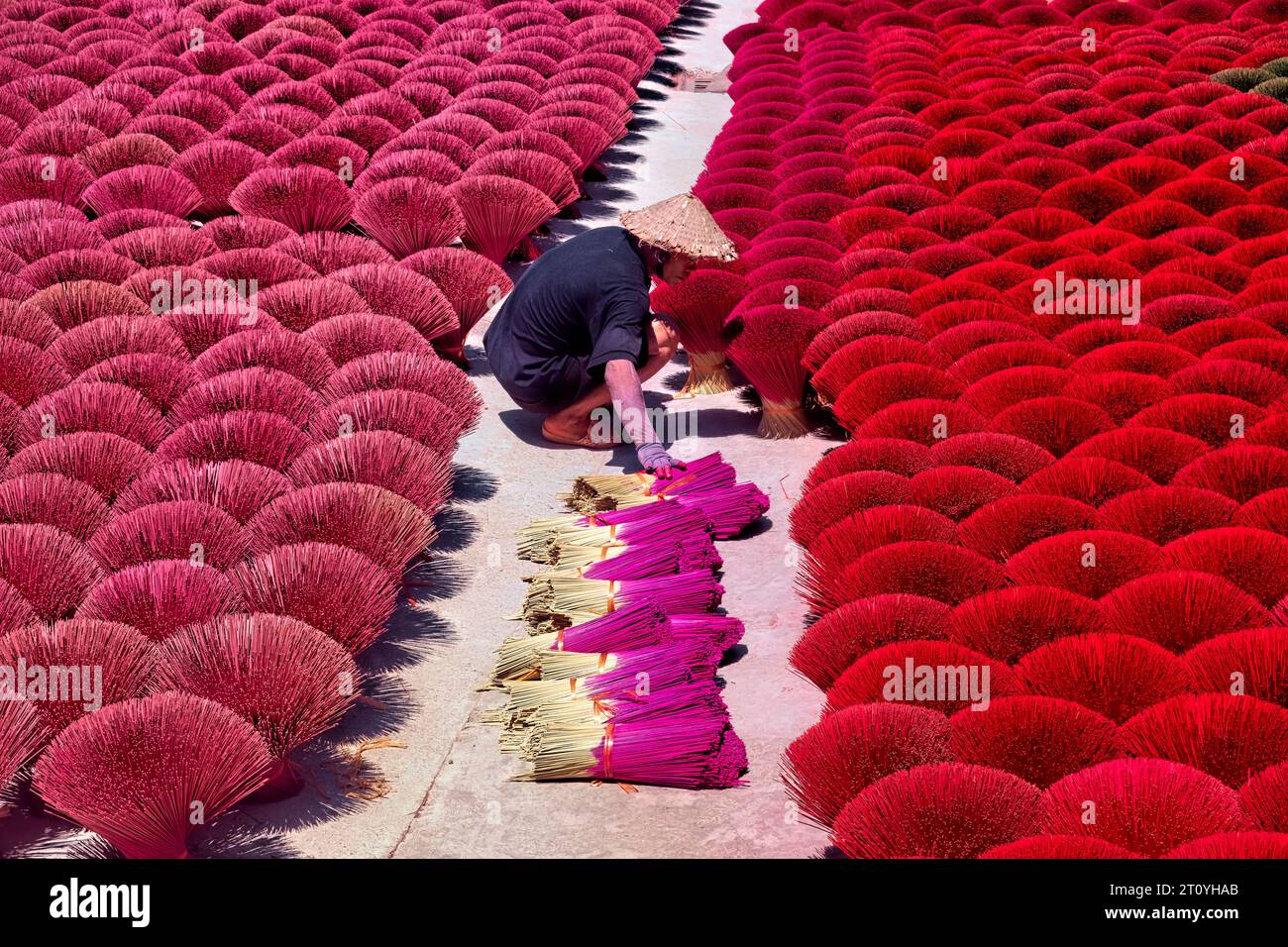 Worker drying incense in the Quang Phu Cau incense village, Hanoi ...
