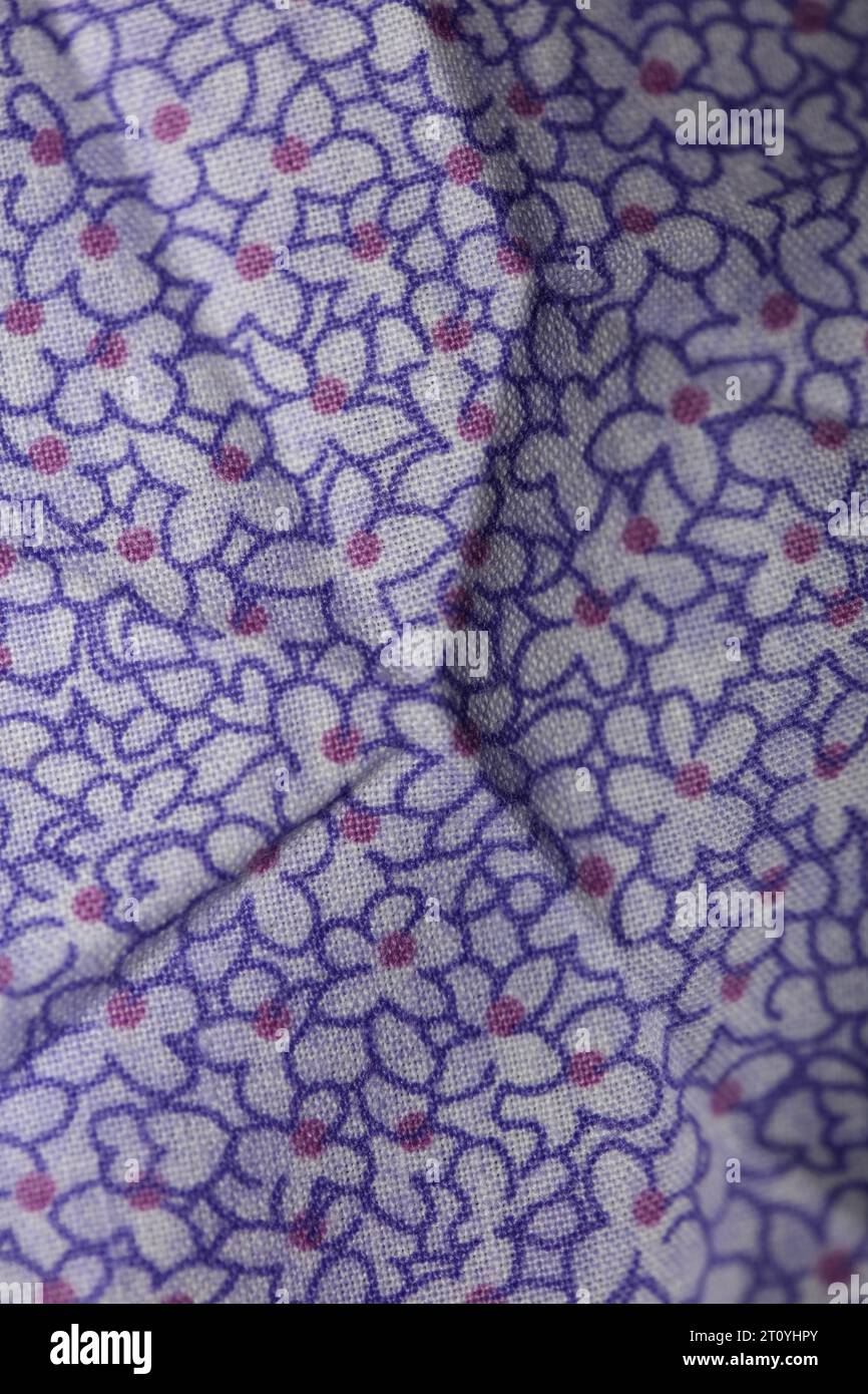Violet purple textile design with colorful flowers close up background ...