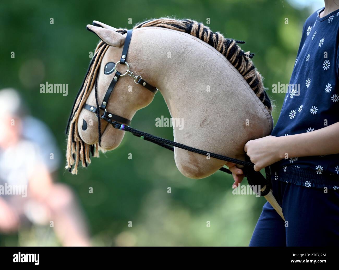 Berlin, Germany. 24th Sep, 2023. A girl holds her Hobby Horse at the ...