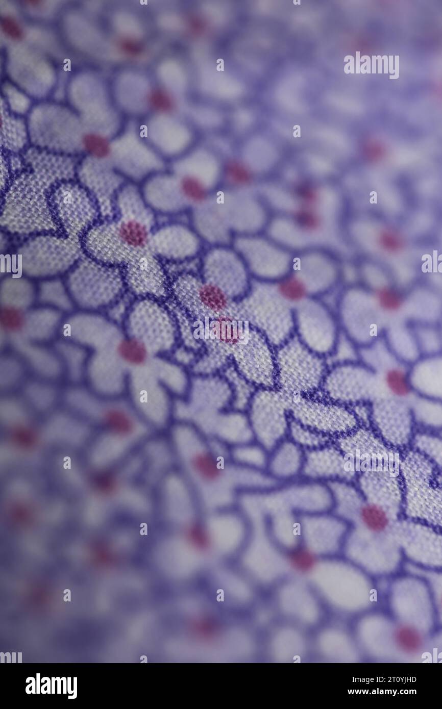 Violet purple textile design with colorful flowers close up background ...