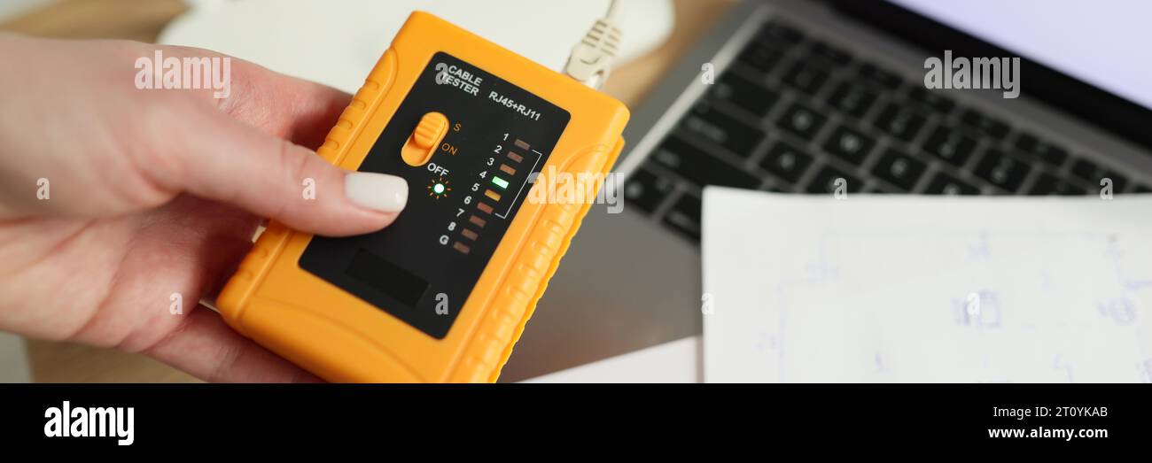 Hand of woman holding LAN speed tester for checking network Stock Photo ...