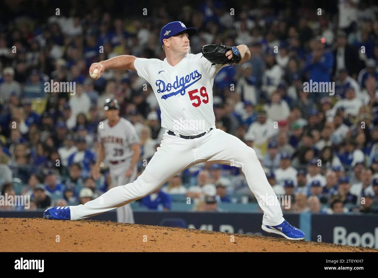 Los Angeles Dodgers relief pitcher Evan Phillips (59) throws to a ...
