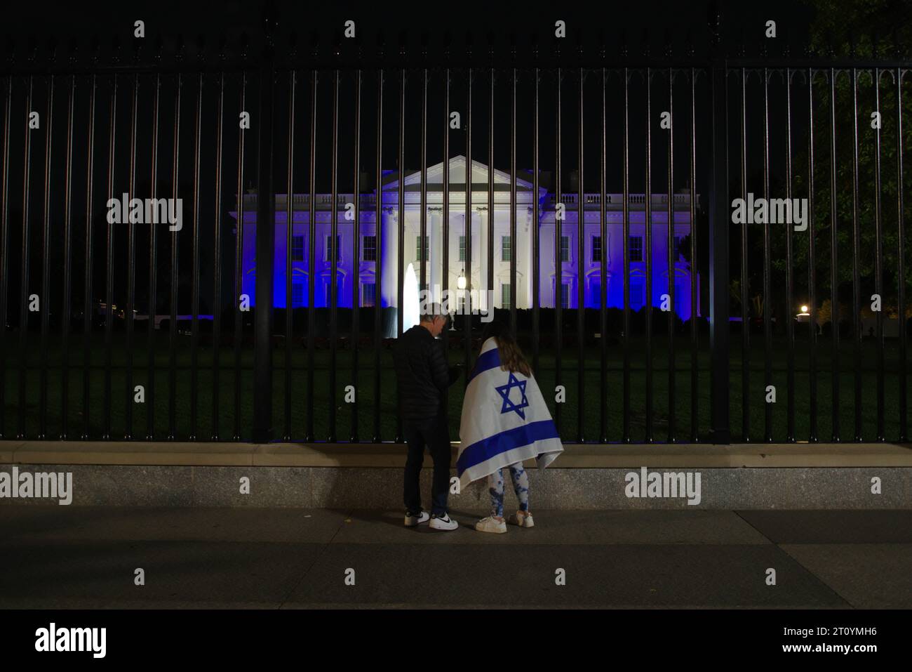 Washington, DC, USA. 9 Oct 2023. A woman draped in an Israeli flag ...
