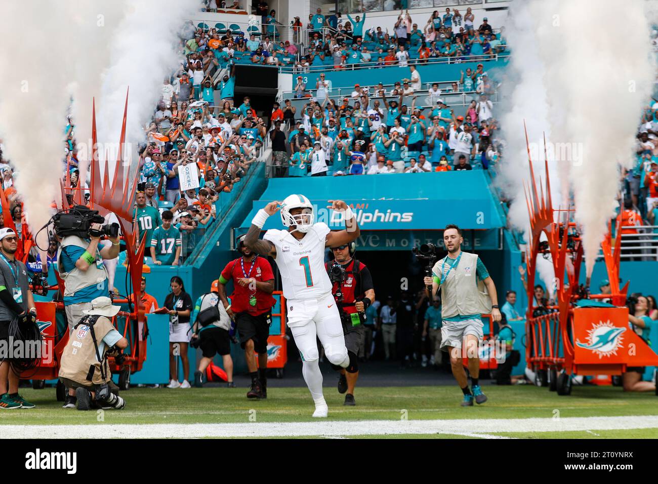 Miami Dolphins quarterback Tua Tagovailoa (1) runs out of the entrance ...