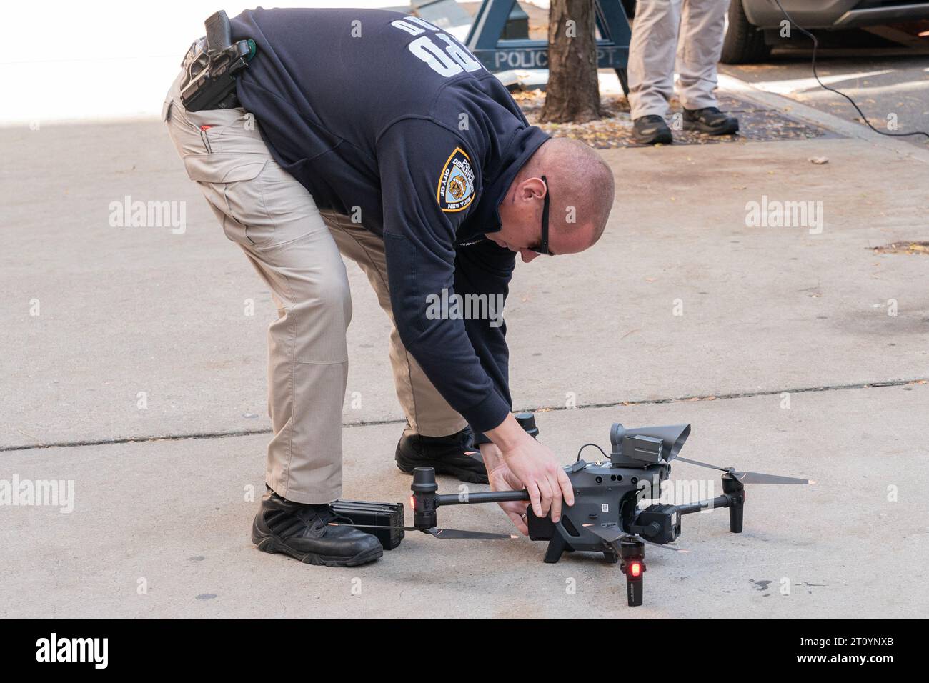 Police officer launches drone to monitor Israeli and Palestinian ...