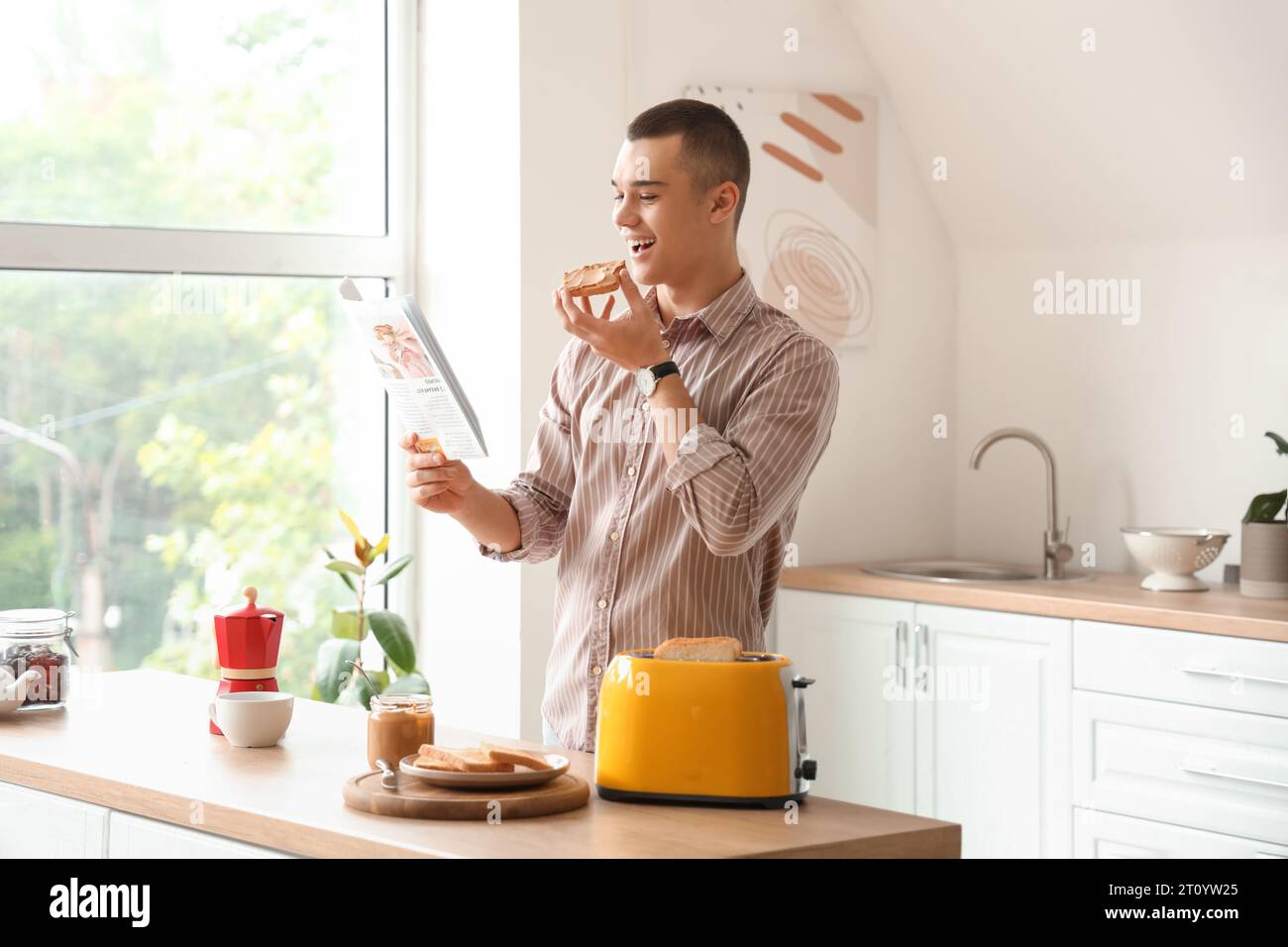 Man eating toast hi-res stock photography and images - Alamy
