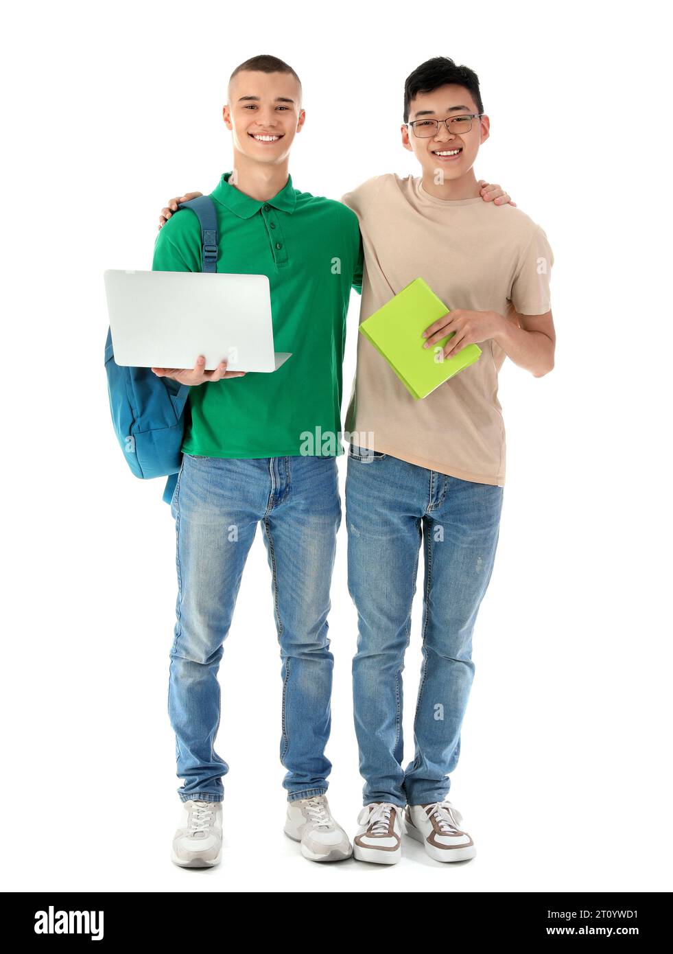 Happy male students with notebooks and laptop isolated on white ...
