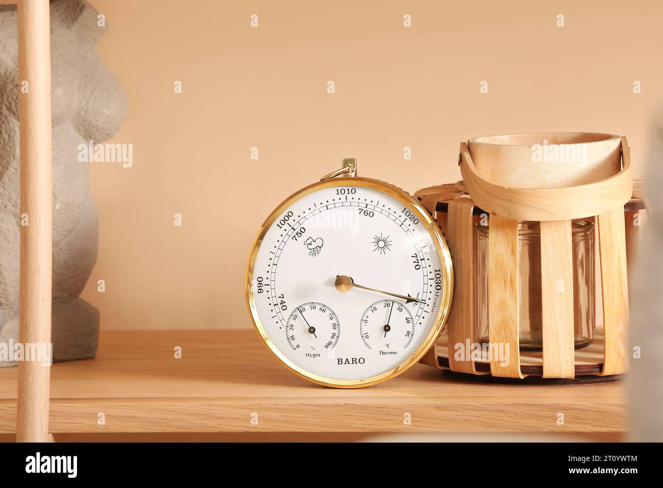 Aneroid barometer and decor on shelving unit in room, closeup Stock ...