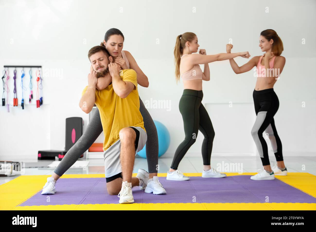 Young women training at self defense courses in gym Stock Photo - Alamy