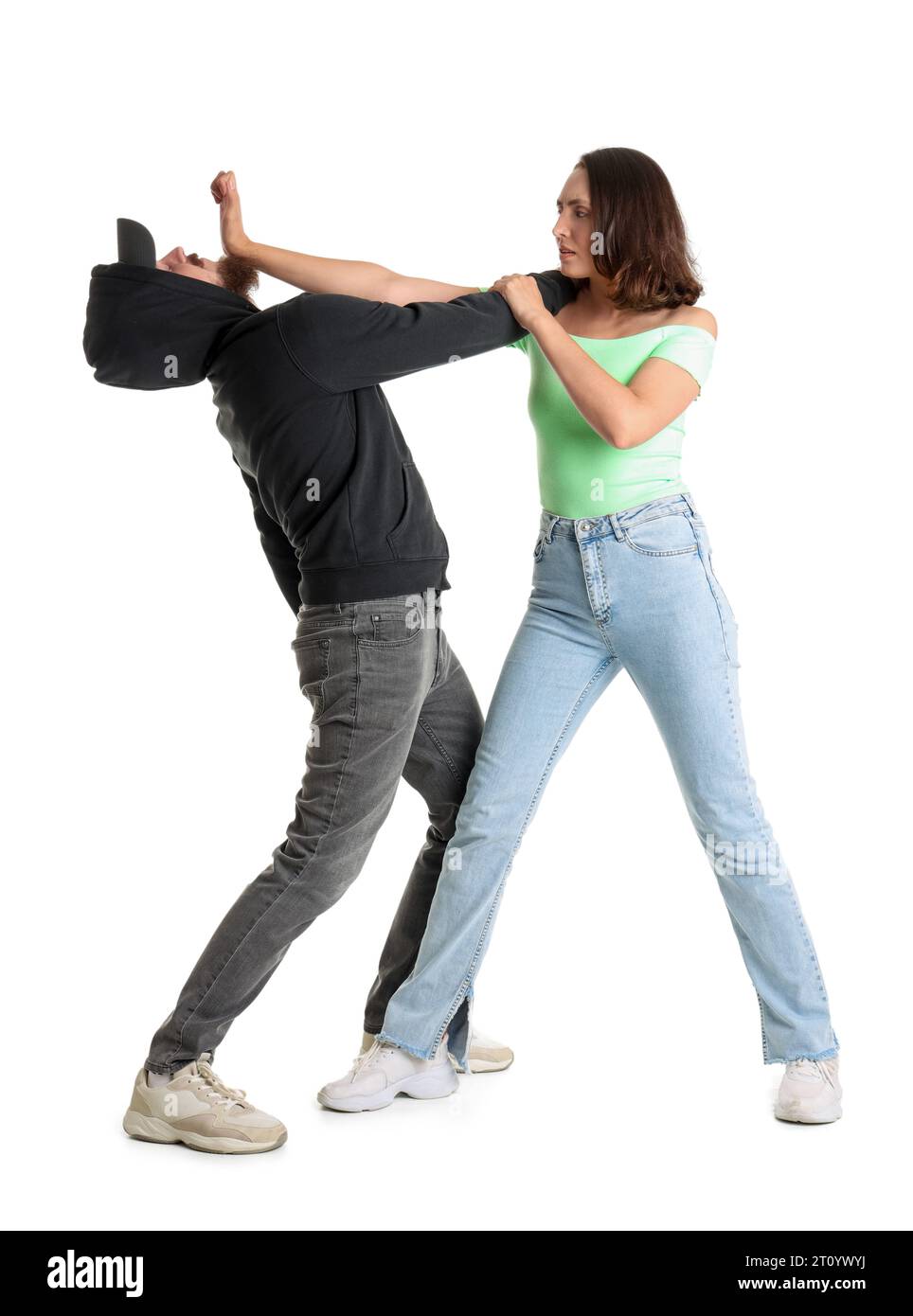 Young woman defending herself against robber on white background Stock ...