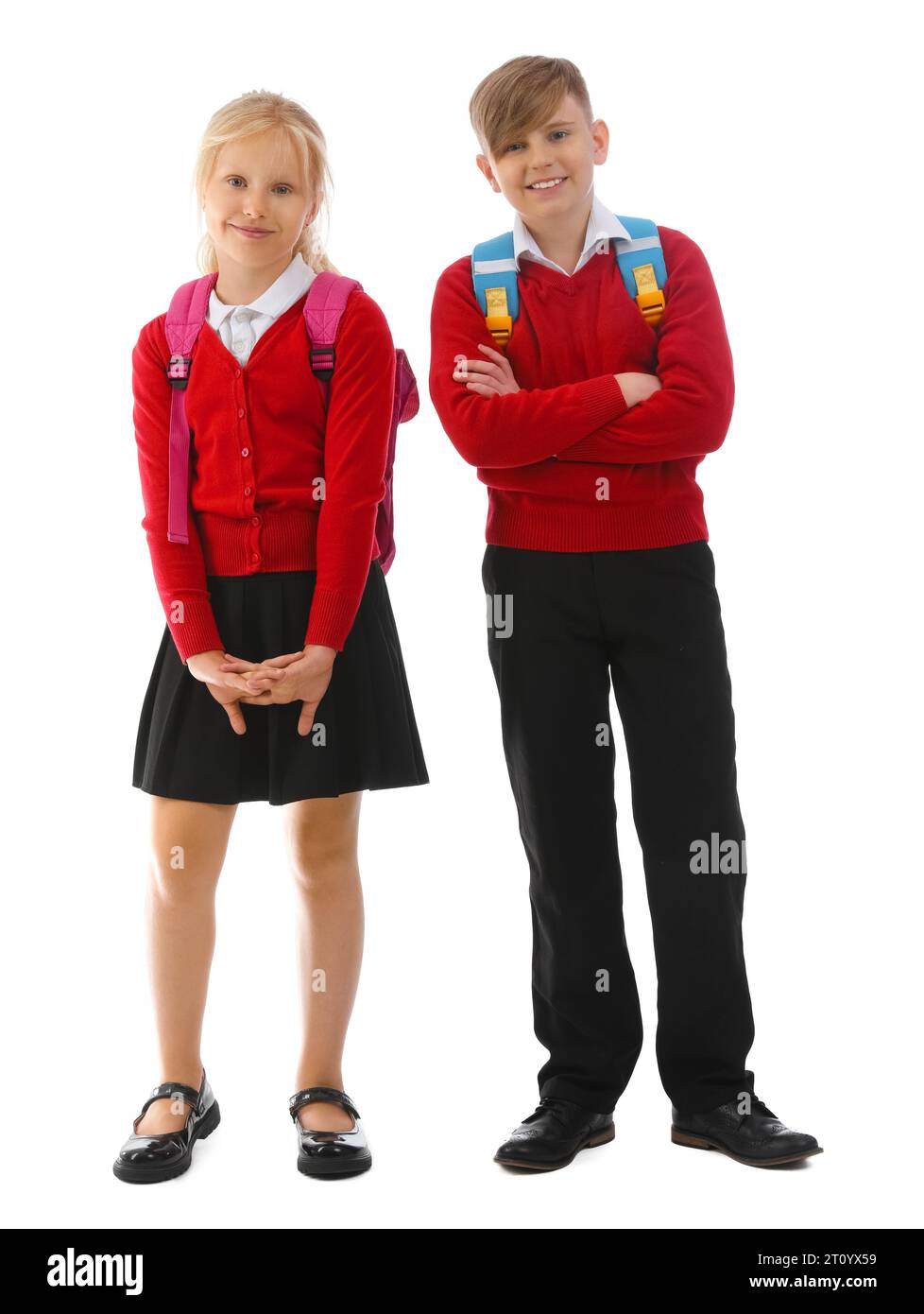 Little classmates in stylish uniform with backpacks isolated on white ...