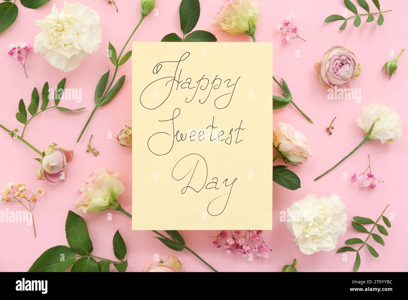 Card with text HAPPY SWEETEST DAY and flowers on pink background Stock ...