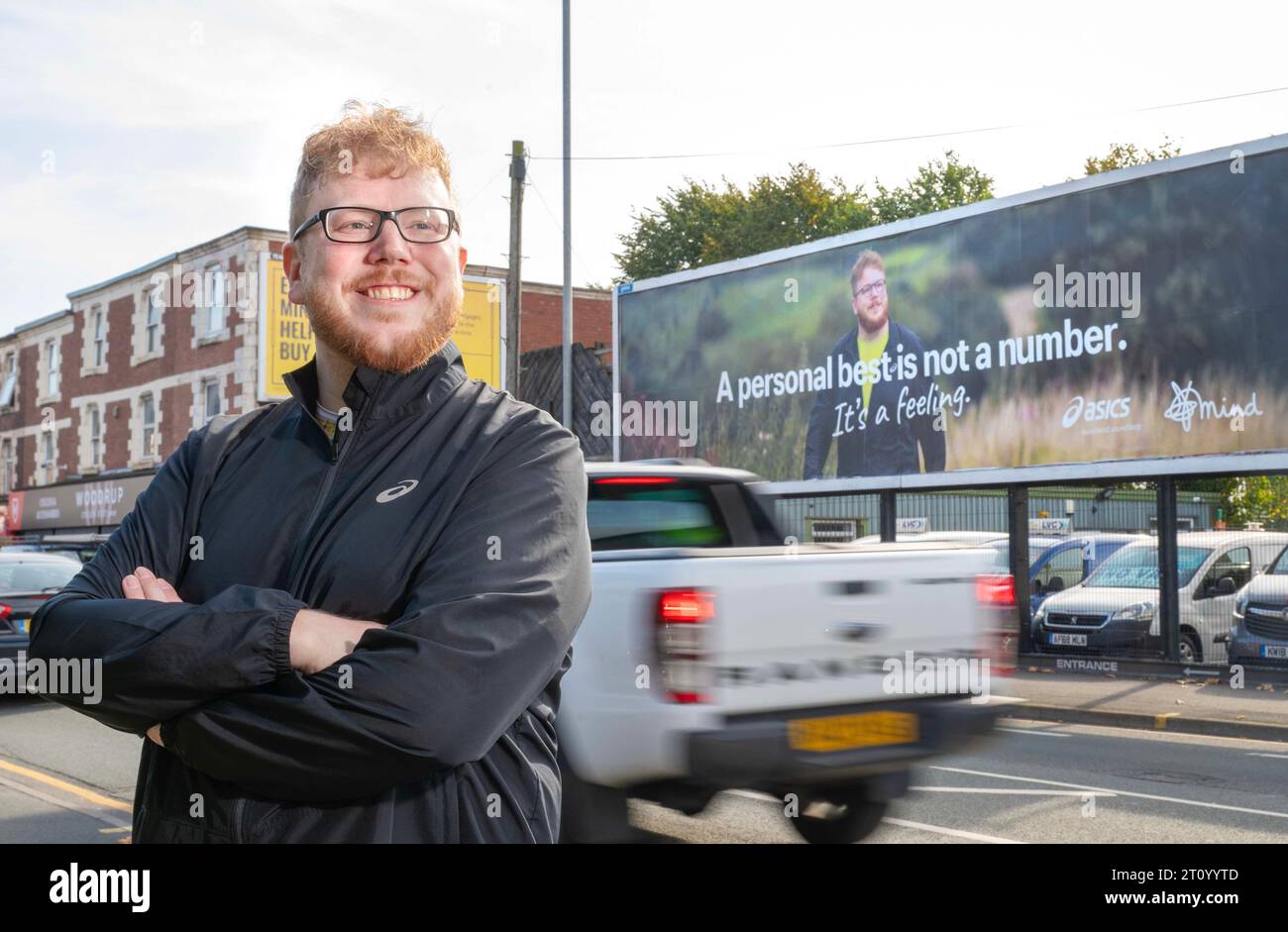 EDITORIAL USE ONLY Adam Folkard , ASICS ambassador, views a billboard ...