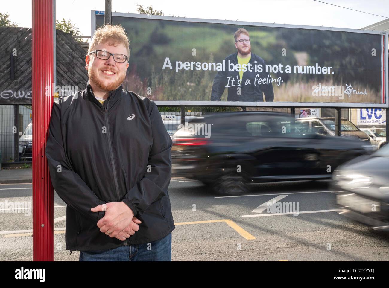 EDITORIAL USE ONLY Adam Folkard , ASICS ambassador, views a billboard ...