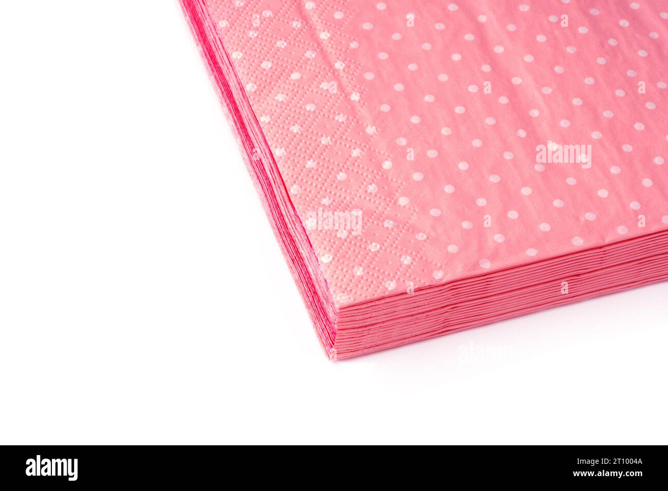Stack of pink dotted paper napkins on white background Stock Photo - Alamy
