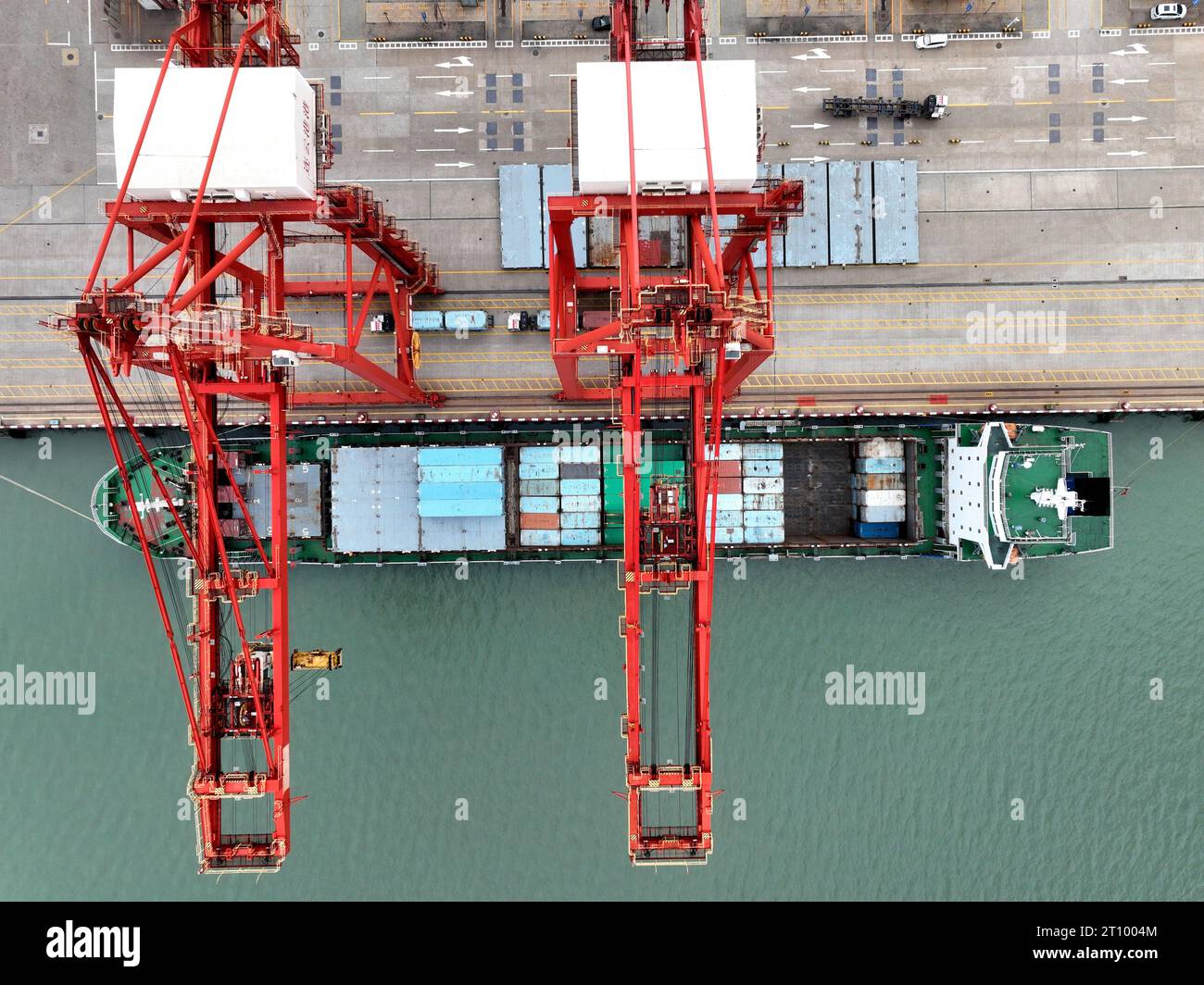 LIANYUNGANG, CHINA - OCTOBER 10, 2023 - Cargo ships stop at their ...