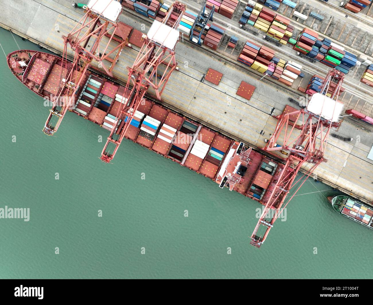 LIANYUNGANG, CHINA - OCTOBER 10, 2023 - Cargo ships stop at their ...