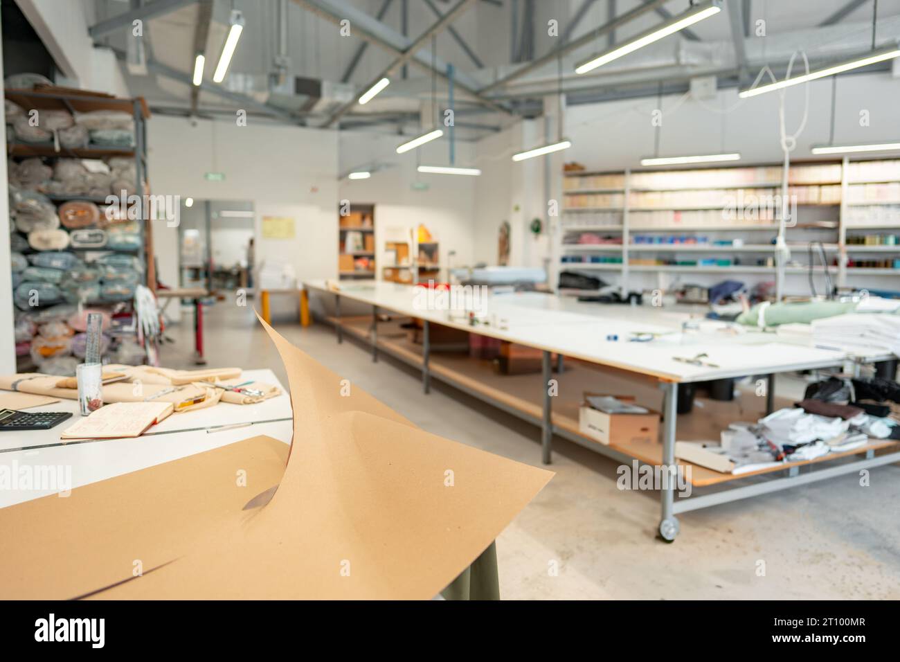 Interior of a sewing warehouse of furniture factory with equipment and ...