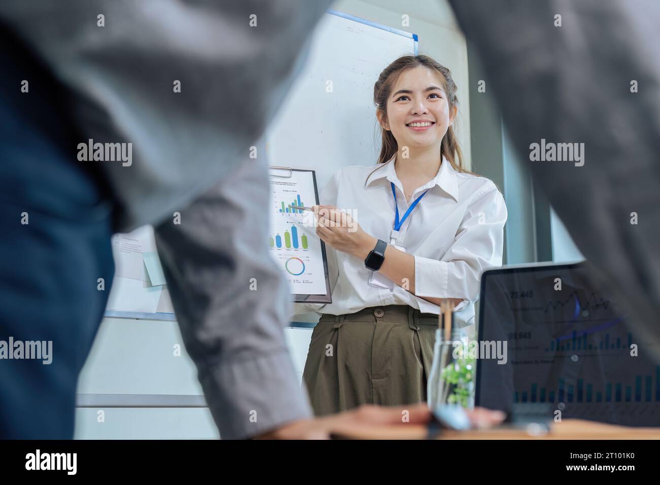 Business woman present business strategy plan to corporate colleagues ...