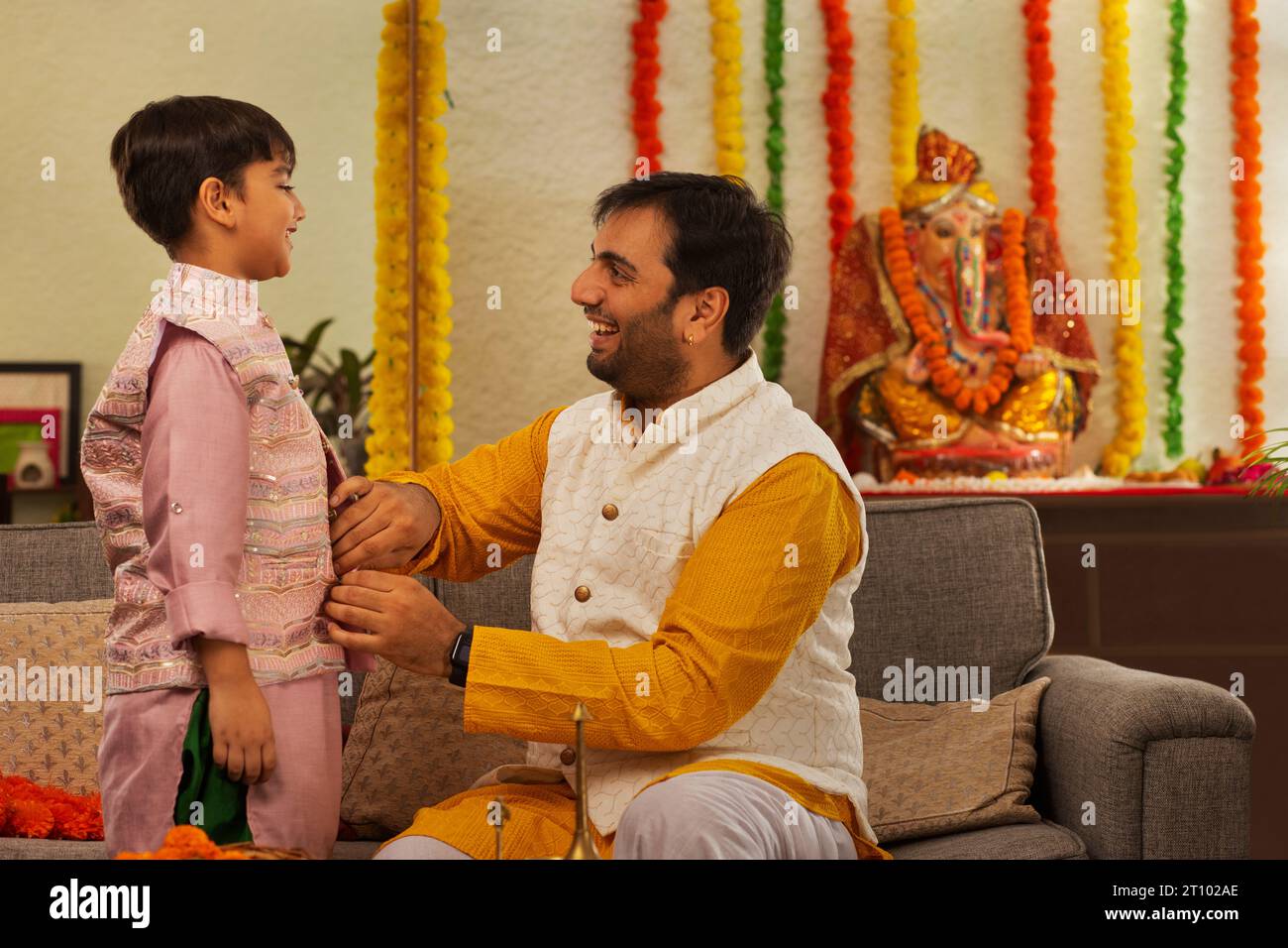 Father and son getting ready to celebrate Ganesh Chaturthi a festival ...