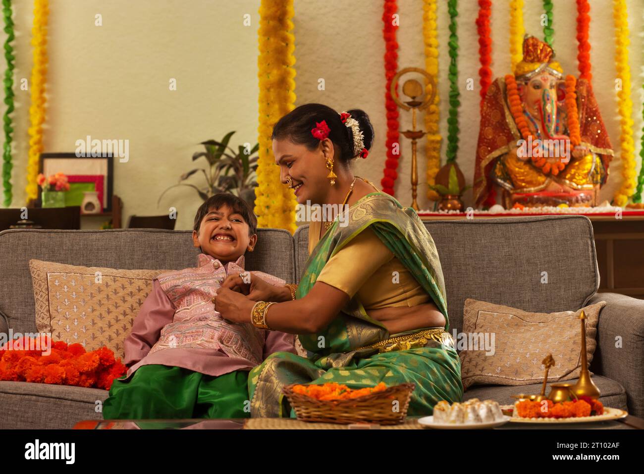 Grandmother and grandson enjoying a conversation during Ganesh ...