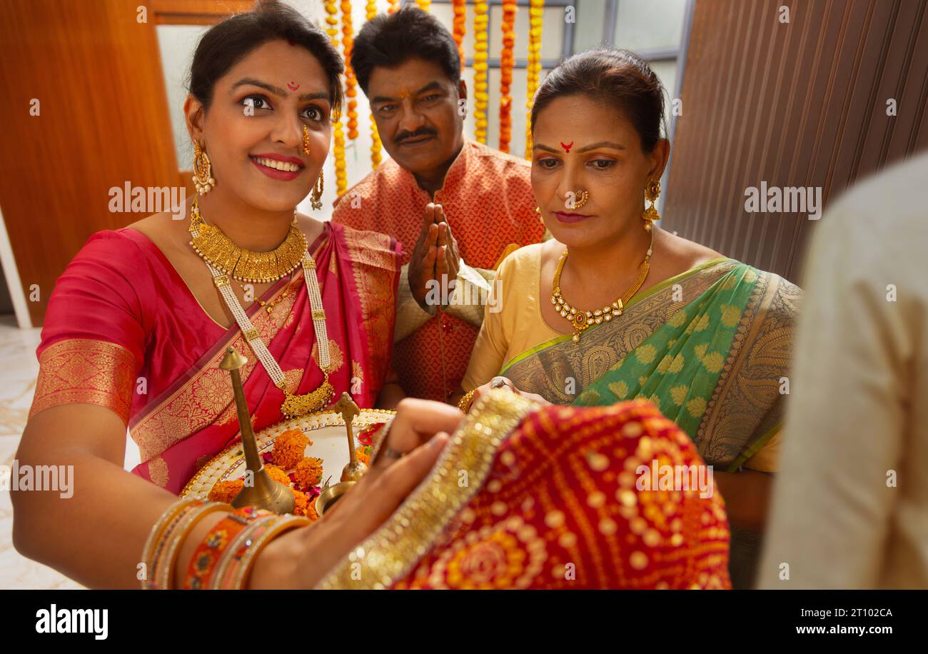 Family bringing Lord Ganesh home during Ganesh Chaturthi a festival ...