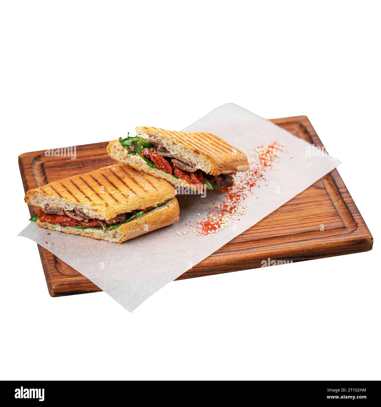 Cut in half panini sandwich on serving board Stock Photo - Alamy
