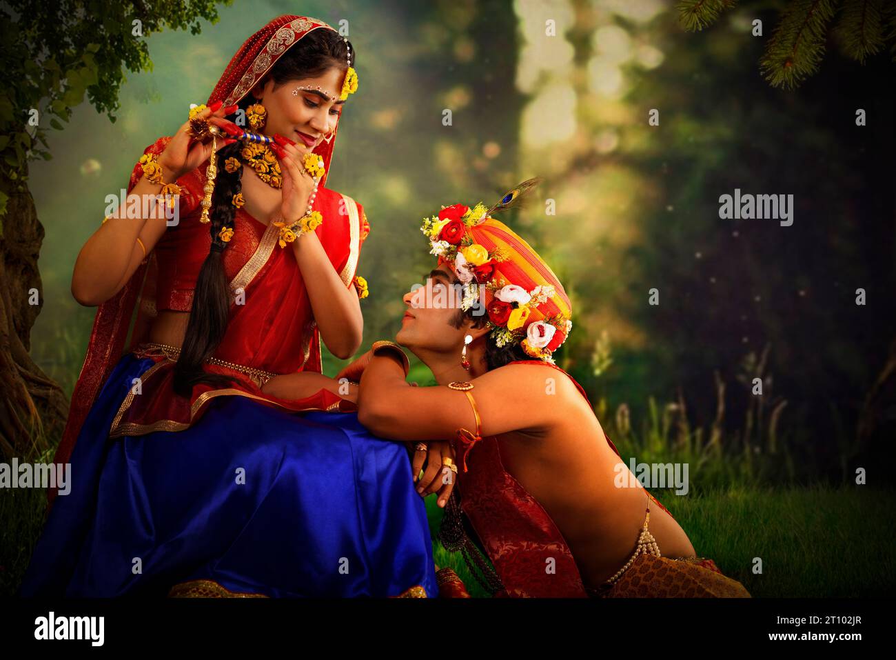 Young man and woman dressed up as Radha and Krishna and romancing on ...