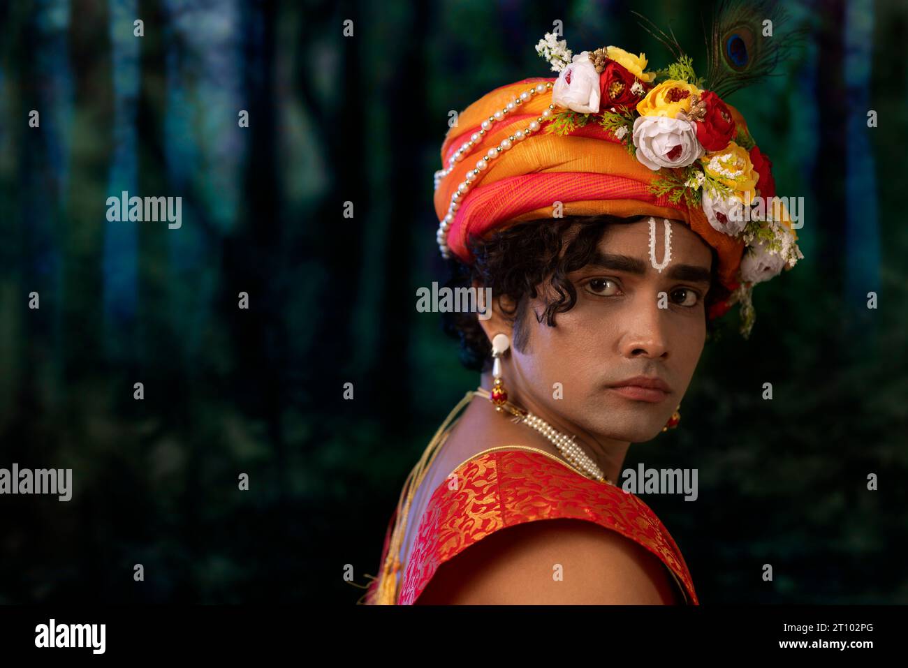 Close-up portrait of young man dressed up as Lord Krishna on the ...