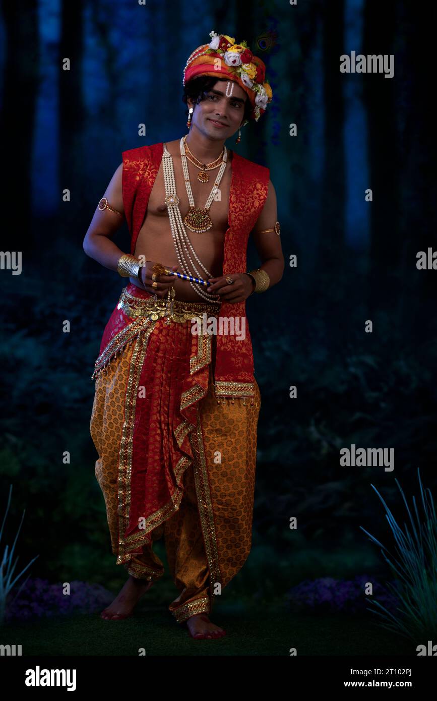 Young man dressed up as Lord Krishna on the occasion of Janmashtami ...