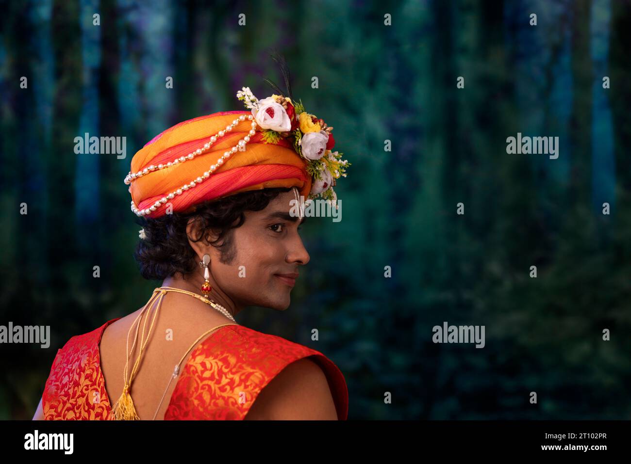 Close-up portrait of young man dressed up as Lord Krishna on the ...