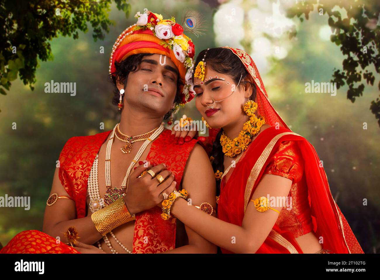 Young man and woman dressed up as Radha and Krishna and romancing on ...