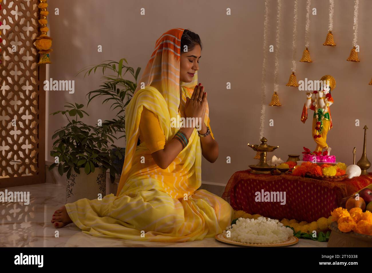 Woman praying to Lord Krishna on the occasion of Janmashtami Stock ...