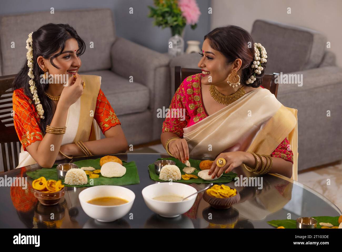 Happy women having Onam Sadhya together at home Stock Photo - Alamy