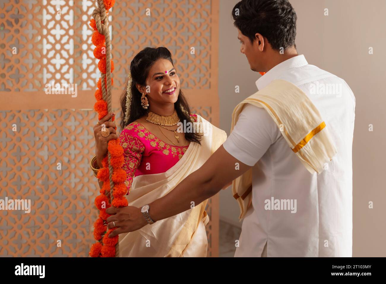 South Indian couple celebrating Onam at home Stock Photo - Alamy